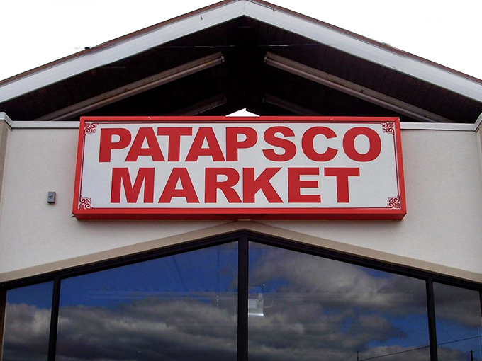 The bold red Patapsco Market sign stands out against cloudy skies. Even the weather can't dampen a good treasure hunt!