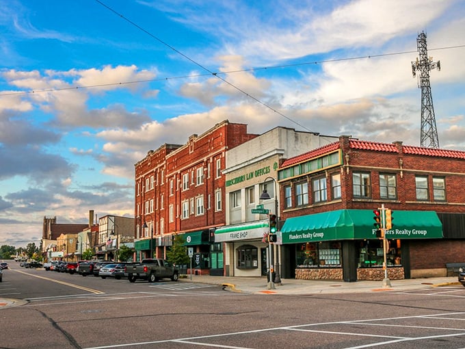 Classic brick architecture and green awnings create a welcoming atmosphere in downtown Rhinelander, an affordable retirement destination.