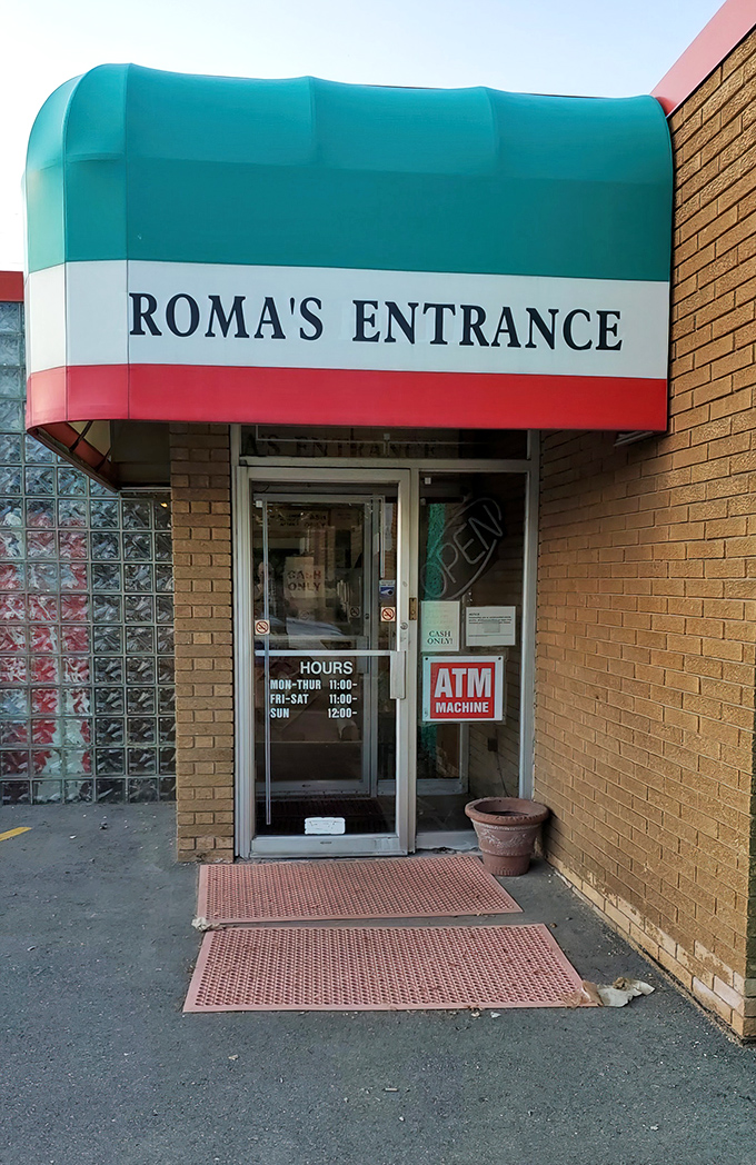 The Italian flag colors above Roma's entrance aren't just decoration &ndash; they're a promise of the old-world flavors waiting inside.