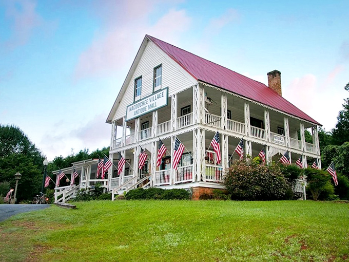 The Sautee Nacoochee Center's white clapboard charm preserves mountain heritage. Those American flags add just the right patriotic touch!