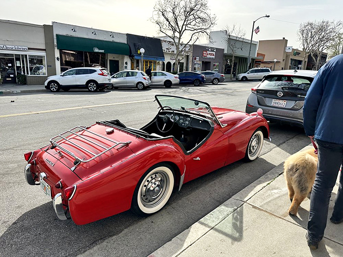 A classic red sports car adds a splash of color to Sierra Madre's charming downtown, where time seems to move a little slower.