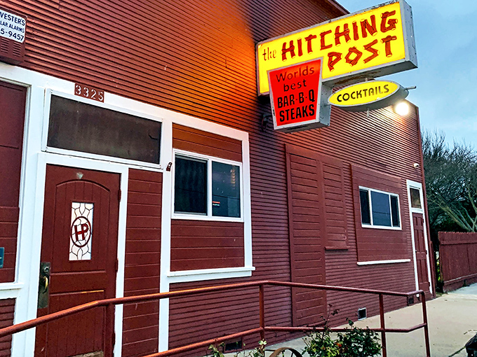 That vintage sign isn't retro design&mdash;it's authentic history smoking with confidence. The Hitching Post doesn't follow BBQ trends; it set them before most of us were born.