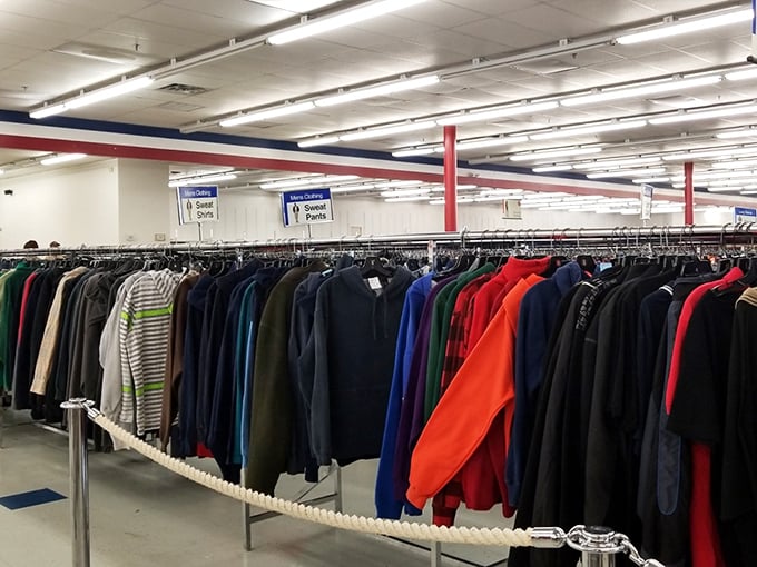 A rainbow of clothing options stretches as far as the eye can see in this thrifter's dream destination.