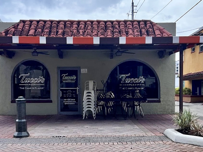 Tucci's Fire N Coal Pizza: Small building, big flavors &ndash; where coal-fired magic happens behind those unassuming arched windows.