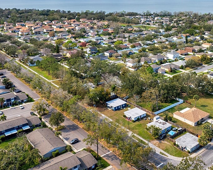 Winter Garden's aerial view reveals a patchwork of neighborhoods nestled between lush greenery and coastal waters.