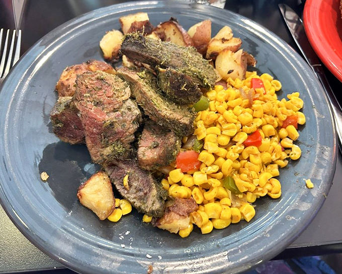 Perfectly cooked steak with potatoes and corn&mdash;proof that Scotty's excels beyond breakfast and sandwiches. Hearty, satisfying, and beautifully plated.