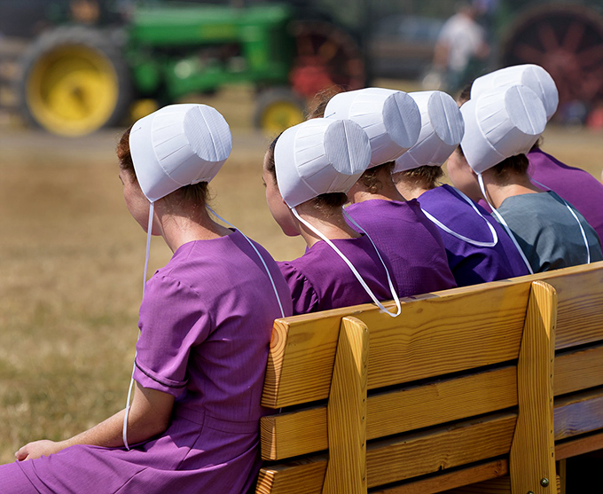 Purple dresses and white prayer caps create a visual rhythm &ndash; these young women represent a culture where community still trumps individuality.