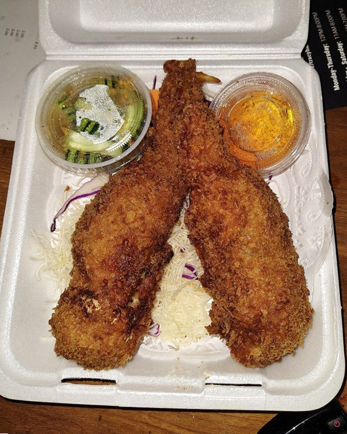 These golden-fried delights arrive in their takeout container like crispy messengers from the comfort food gods, complete with dipping ambassadors.