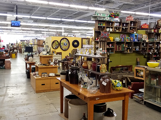 The organized chaos of vendor booths creates neighborhoods within this antique metropolis. Each turn reveals a new specialty.