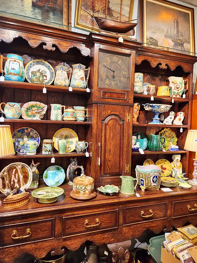 Majolica, porcelain, and pottery, oh my! This magnificent hutch showcases ceramics that have survived longer than most Hollywood marriages.