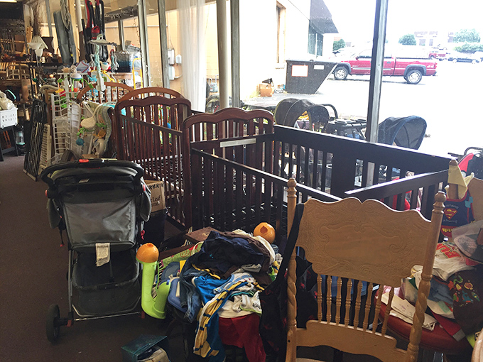 Gently used cribs and strollers stand ready for deployment, like a well-organized fleet prepared to serve the next generation of tiny commanders.