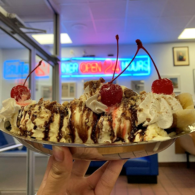 A banana split that laughs in the face of moderation. Those cherries on top aren't garnish—they're the crown jewels of a dessert empire.