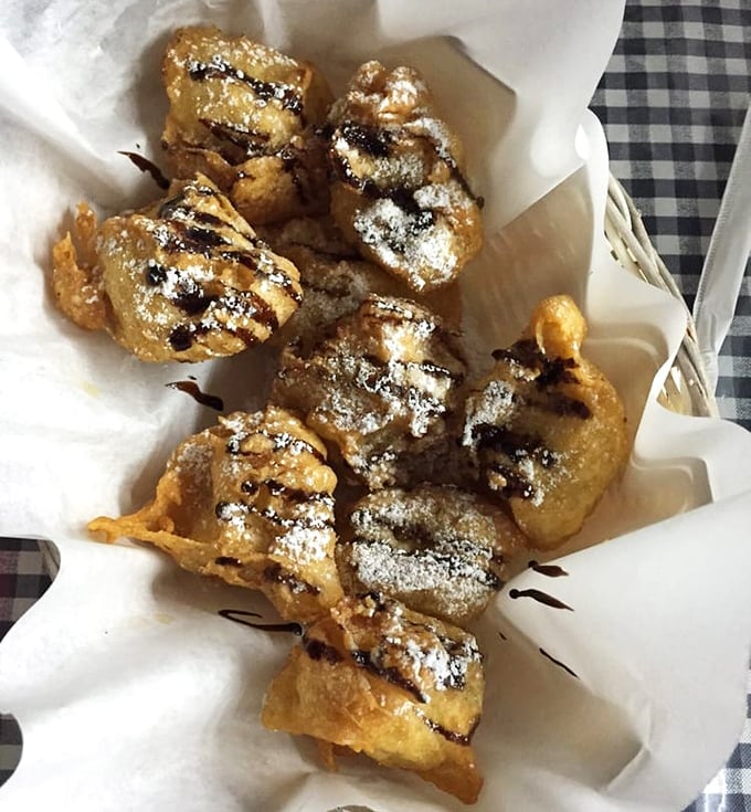 Dessert that makes you question why we don't fry more fruit. These banana fritters with chocolate drizzle are the sweet finale your meal deserves.