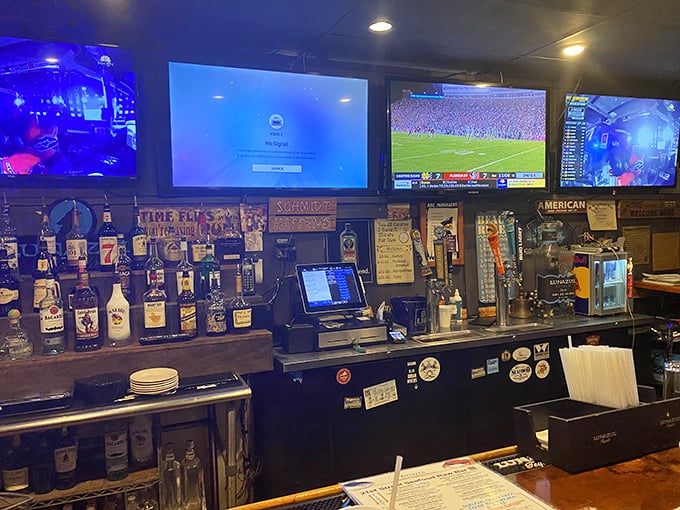 The command center where cold beverages flow and sports play, creating the perfect backdrop for seafood feasting.