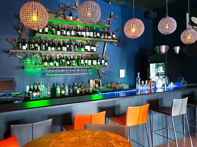 The bar beckons with promise of perfectly crafted cocktails to complement your enchilada adventure in style.