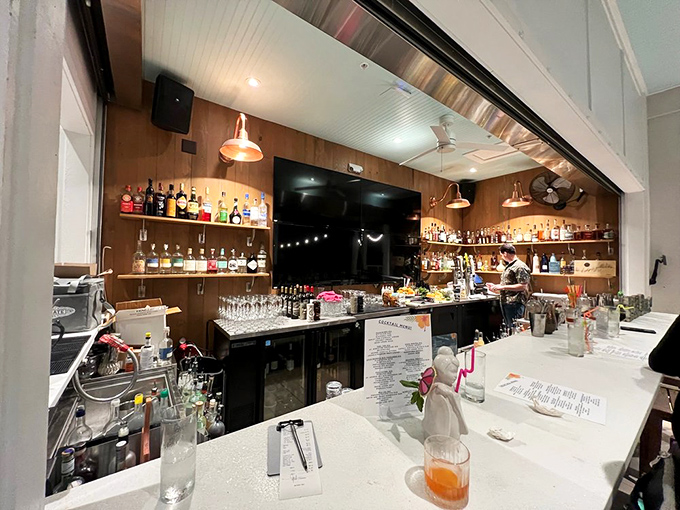 A bar setup that takes its spirits as seriously as its steaks, with bottles arranged like trophies.