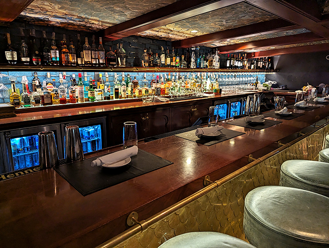 This isn't just a bar&mdash;it's a liquid library with illuminated shelves showcasing spirits from around the world, ready for your research.