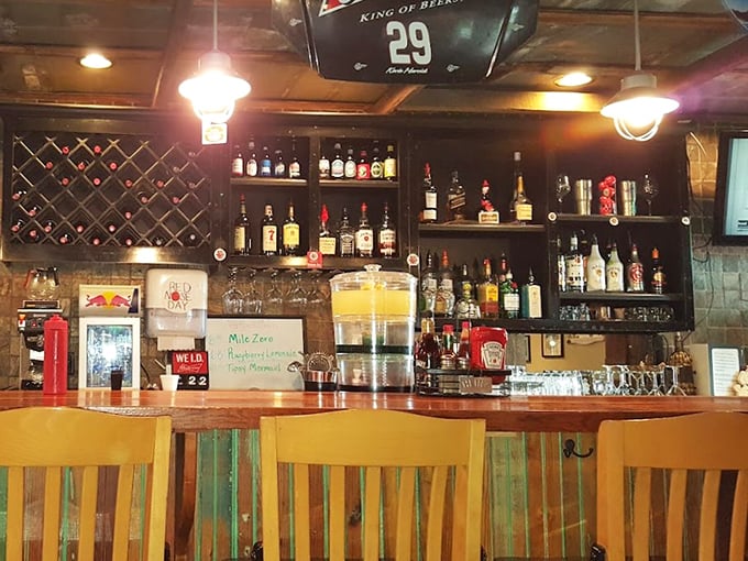 The bar where cold beer meets fresh seafood in perfect harmony. Those colorful chairs add just the right touch of coastal charm.