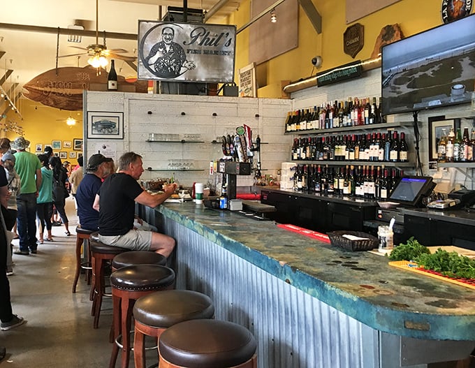 The bar at Phil's isn't just serving drinks; it's dispensing liquid courage to try that exotic seafood special you've been eyeing all night.