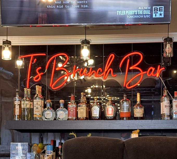 The glowing neon sign behind the well-stocked bar promises good times ahead—brunch cocktails are serious business here.