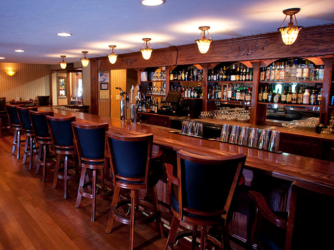 The bar beckons with the promise of perfectly mixed cocktails and conversations that flow as smoothly as their top-shelf bourbon.