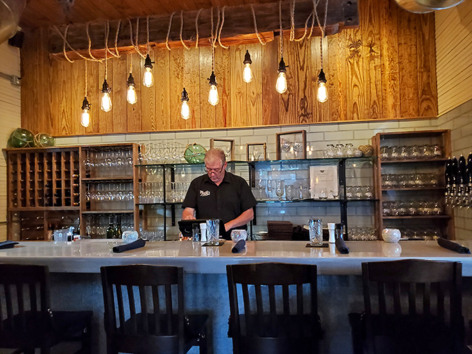 Behind every great restaurant is a bar where magic happens. Those hanging Edison bulbs create the perfect ambiance for crafting both cocktails and memories.