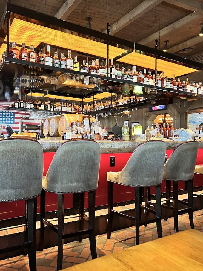 A bourbon collection that would make Kentucky jealous, displayed like liquid amber treasures beneath warm lighting.