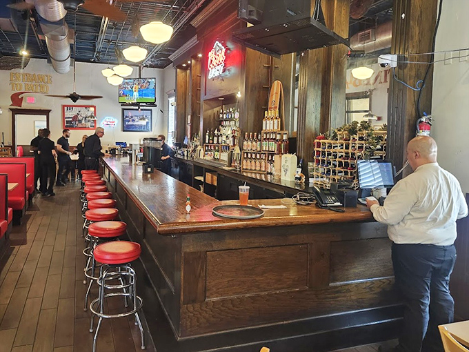 The well-stocked bar stands ready for those moments when cracking shells requires liquid courage or celebration.