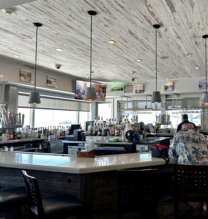 A bar where everybody might not know your name yet, but they'll remember your drink order by visit two. That weathered ceiling has heard all the fish stories.