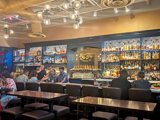 A bar stocked so beautifully it could make a teetotaler reconsider their life choices. Bottles gleam like treasure in a grown-up playground.
