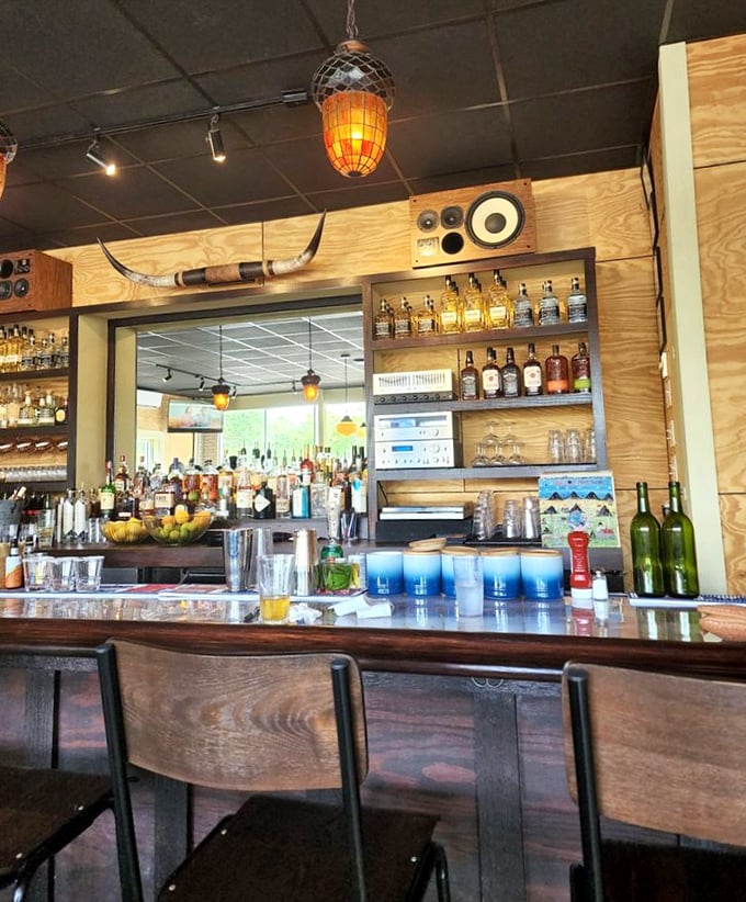 Behind every great burger joint is a bar that understands its supporting role. Note the longhorns watching over your drinking decisions.