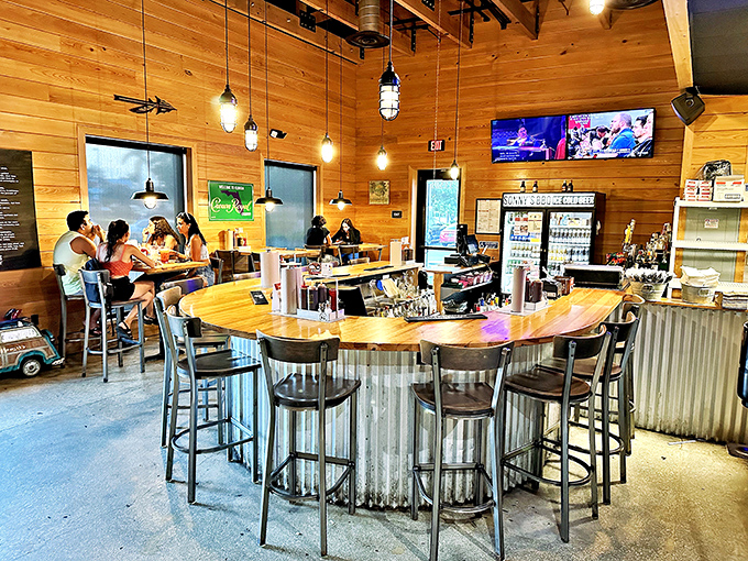 The bar area: where decisions about sauce selection are made with the gravity they deserve. Wood and metal creating the perfect BBQ backdrop.