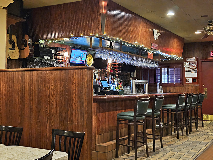 The bar area: where strangers become friends and regulars are treated like royalty. Notice the guitars&mdash;music and good food always belong together.