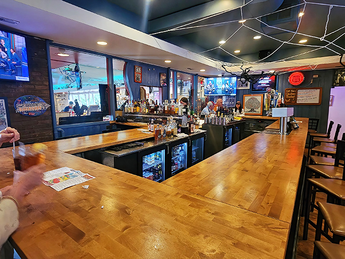 The bar area &ndash; where cocktails meet comfort in a wood-paneled sanctuary of hospitality and good cheer.