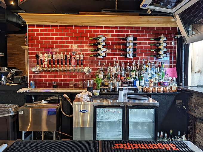 Behind vibrant red tiles, liquid magic happens. This isn't just a bar&mdash;it's the stage where beer and spirits perform their most impressive tricks.