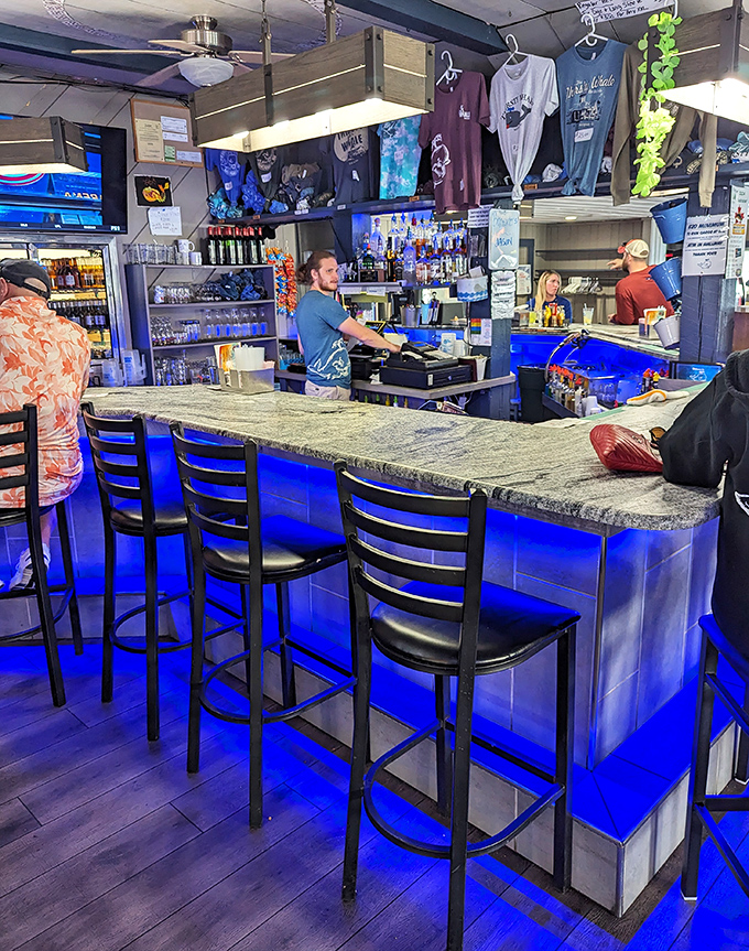 The bar area offers the perfect spot to enjoy a cold beer while waiting for your legendary sandwich.