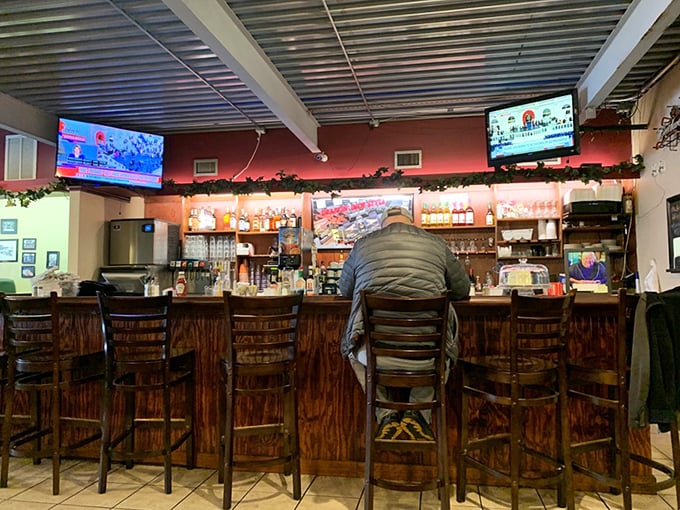 The wooden bar invites you to pull up a stool, chat with neighbors, and discover why Abner's feels more like a community living room than just a restaurant.