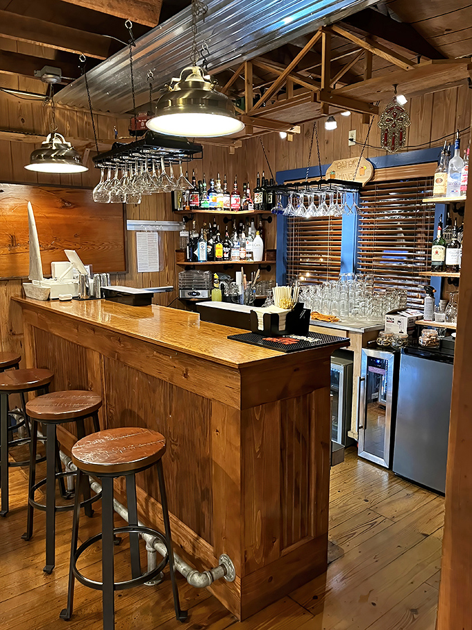 The bar area&mdash;where seafood stories get better with each round. Those hanging glasses are just waiting for their moment.