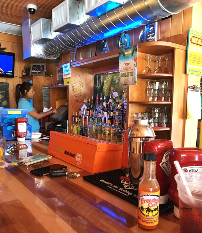 The bar stands ready for action, with enough hot sauce options to start a small fire department.