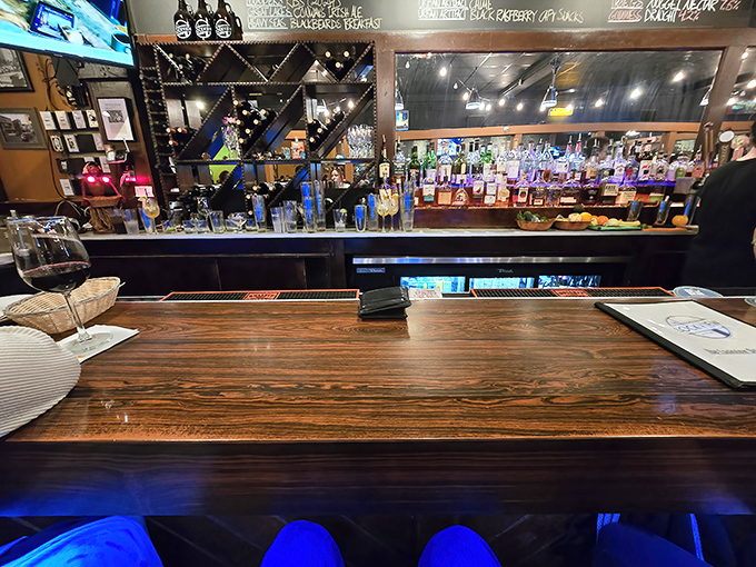 The bar's impressive lineup of bottles stands ready like soldiers awaiting orders to enhance your grilled cheese adventure.