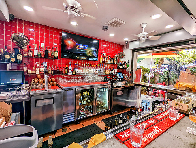 That bar's red tile backdrop makes every drink look like it's ready for its close-up.