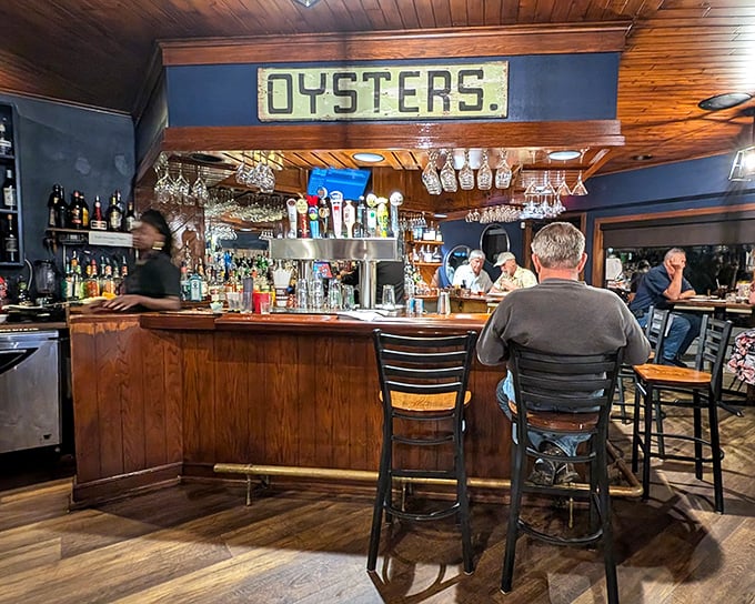 The "OYSTERS" sign above the bar isn't just decoration&mdash;it's a promise. This is a place that takes its Chesapeake Bay bounty seriously.