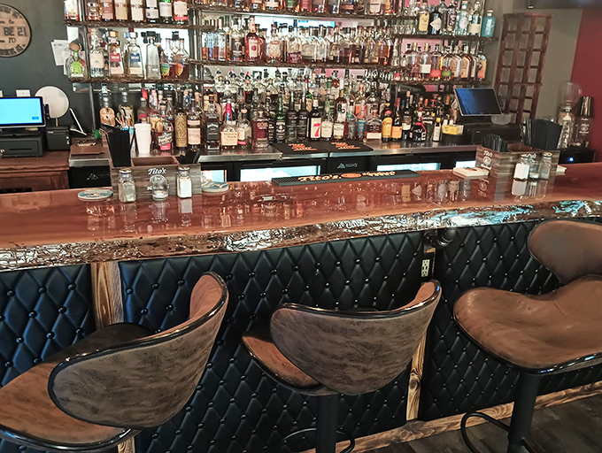 The bar's quilted leather front and rustic wood top create the perfect perch for bourbon sipping and menu contemplation. Those chairs practically beg you to stay awhile.