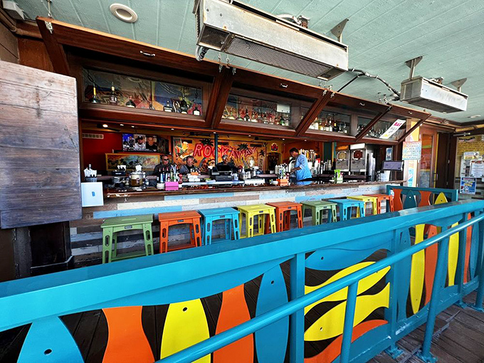 The rainbow of bar stools looks like a box of crayons melted in the Florida sun&mdash;in the best possible way.