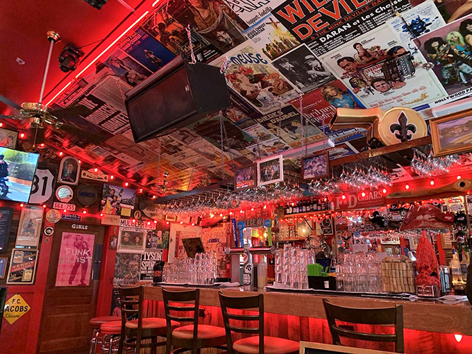 The bar area looks like your coolest friend's basement reimagined by a Broadway set designer with an unlimited budget for vintage memorabilia.