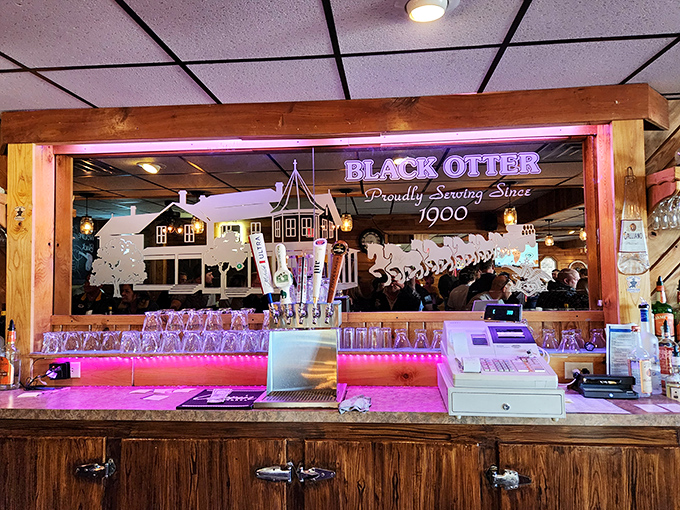 The illuminated bar display proudly announces "Serving Since 1900," a testament to over a century of keeping Wisconsin well-fed and properly lubricated.