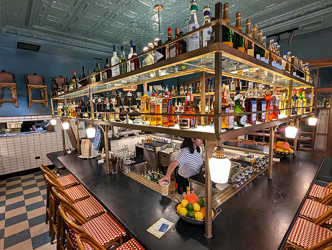 A bar setup so beautiful it makes you want to cancel all appointments and work your way through every bottle on those gleaming shelves.