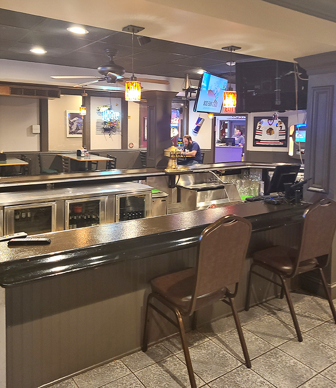 The bar area offers a front-row seat to the game and a direct line to refreshments&mdash;strategic positioning at its finest.