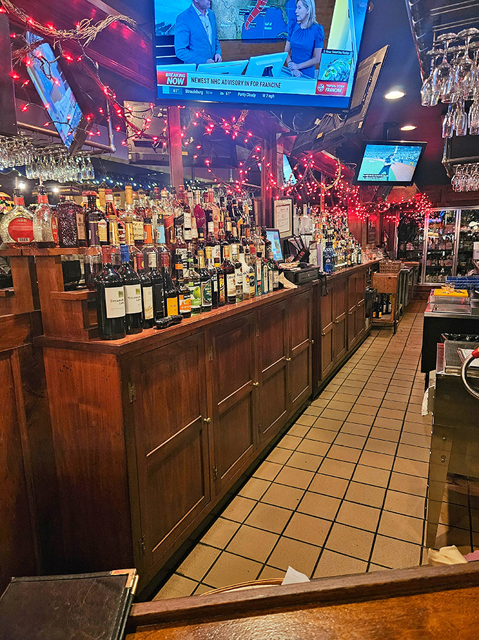 The impressive bar showcases enough spirits to fuel any celebration, with twinkling lights adding festive magic overhead.