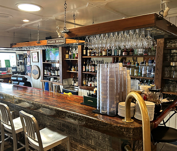 A bar that means business, with glasses hanging like crystal stalactites. This is where liquid refreshment meets maritime charm.